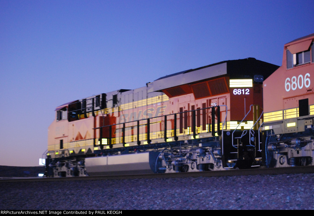BNSF 6812 and BNSF 6806 passs me as my Flash Lights up their BNSF/GE Swoosh Logo and the sunrise ...